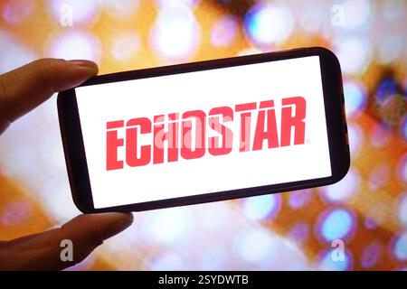 In this photo illustration the EchoStar Corporation logo seen displayed ...