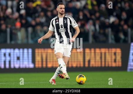 Turin, Italy. 26th Feb, 2025. Liam Henderson of Empoli FC battles for ...