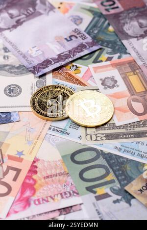 Round metal ethereum on a background of paper banknotes of different ...