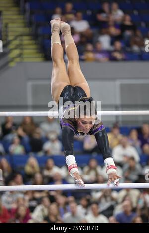 LSU's Lexi Zeiss competes on the uneven bars during the NCAA women's ...