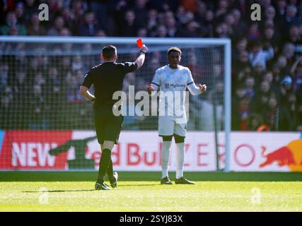 Referee Michael Oliver shows Millwall goalkeeper Liam Roberts (not ...