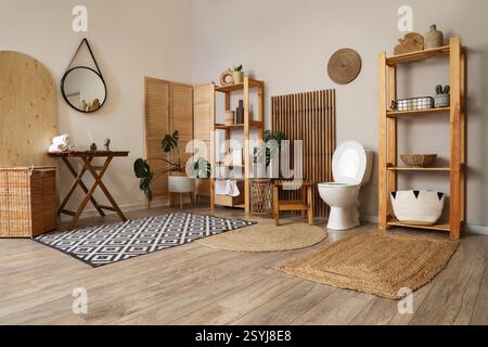 Interior of restroom with toilet bowl, tables and shelf units Stock ...