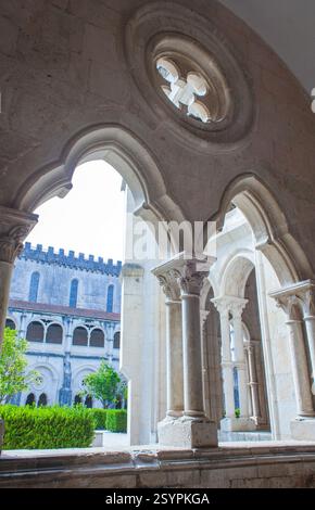 a picturesque view through a series of arched windows within a historic ...