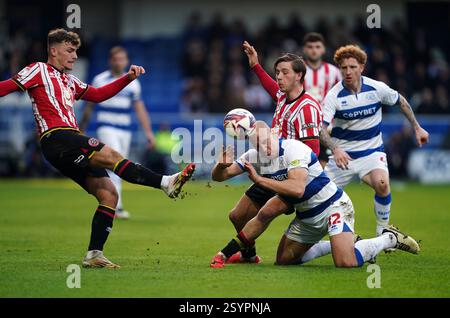 Sheffield United's Harrison Burrows clears the ball under pressure from ...