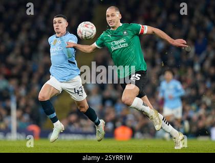 Phil Foden of Manchester City and Nikola Milenkovic of Nottingham ...