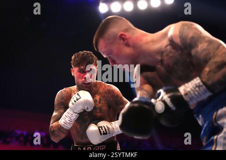 Mace Ruegg (left) in action against Liam Dillon in the lightweight bout ...