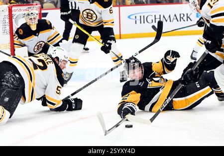 Boston Bruins' Andrew Peeke (52) skates with the puck against the ...