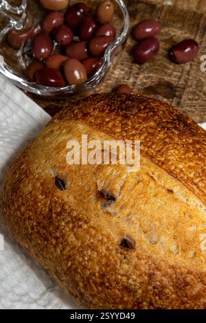 Artisan homemade wheat bread with olives baked in small mountain ...