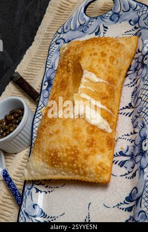 Traditional Brazilian fried cheese pastry known as pastel de feira ...
