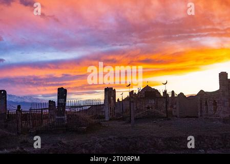 Traditional Muslim cemeteries outside villages in Kyrgyzstan Stock ...