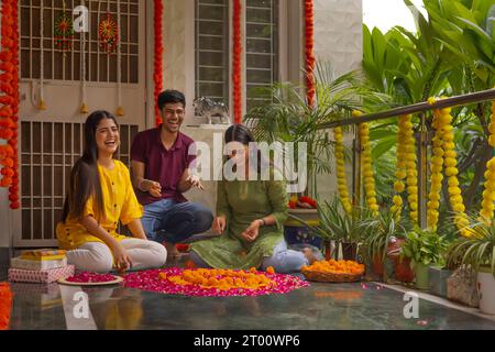 smiling indian man with houseplants at home Stock Photo - Alamy