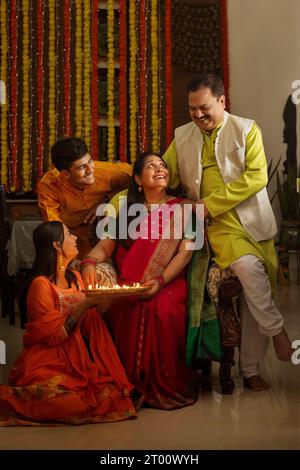 Portrait of family celebrating Diwali Stock Photo - Alamy