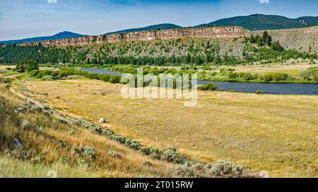 Palisades Cliffs over Upper Madison River, boat ramp area, boats on ...