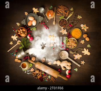 Christmas still life. homemade ginger biscuits, cane candy, on a wooden ...