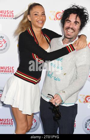 TARZANA, CALIFORNIA - OCTOBER 02: (L-R) Sahara Ray and Mod Sun attend ...