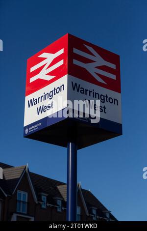 Warrington West railway station sign Stock Photo - Alamy