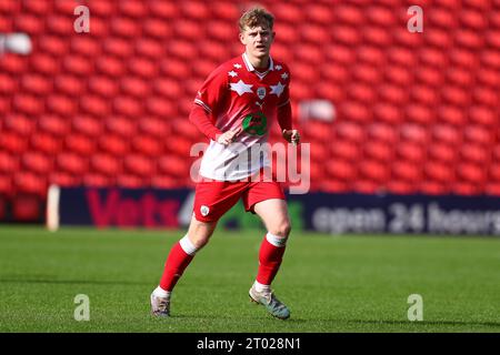 Barnsley, UK. 3rd October, 2023. Theo Chapman #10 of Barnsley slide ...
