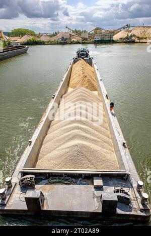 Sand quarry and waterways transportation of the sand. River transport ...