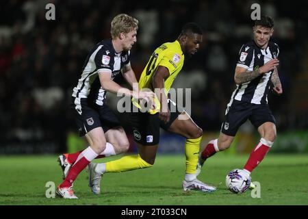 Emile Acquah of Barrow in action with Mansfield Town's Lewis Brunt ...