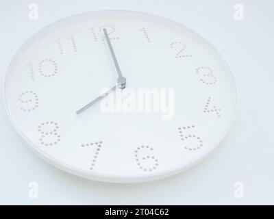 Analog alarm clock showing eight o'clock, 8pm or 8am isolated on white ...