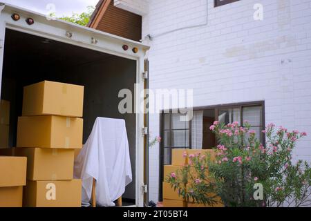 Delivery man move items to the house. Service and delivery concept ...