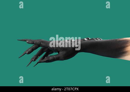 Creepy monster hand with black claws isolated on white background with ...