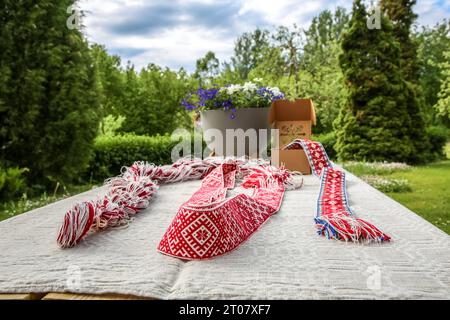 National symbols of Latvia is Lielvarde belt in traditional black and ...