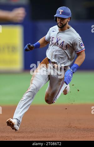 Texas Rangers' Josh Jung runs out a fly out during a baseball game ...