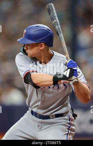 Texas Rangers' Corey Seager, right, scores past Baltimore Orioles ...