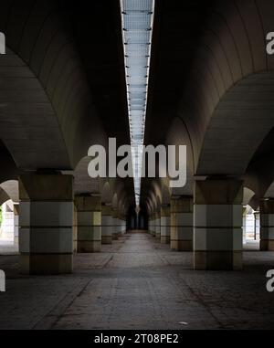 Symmetric view of subway station walkway tunnel. Perspective view of ...
