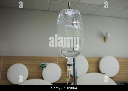 Doctor and nurse use giving saline solution medicine intravenous ...