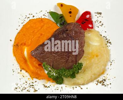 Beef Steak With Pureed Potatoes and Carrots Tabletop Stock Photo - Alamy