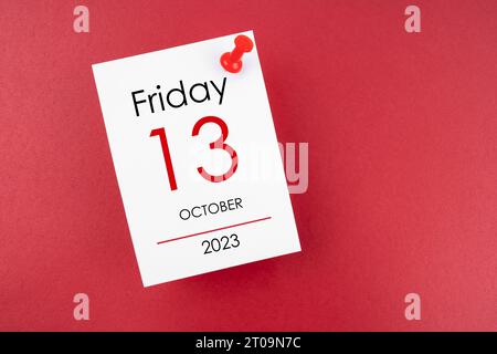 Calendar Friday the 13th October 2023 and push pin on black color ...