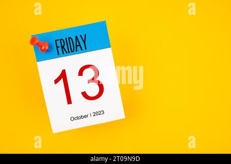 Calendar Friday the 13th October 2023 and push pin on black color ...