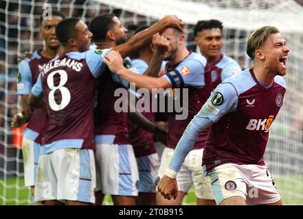 Aston Villa's Matty Cash (right) scores their side's first goal of the ...
