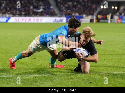New Zealand's Damian McKenzie scores their side's third try during the ...
