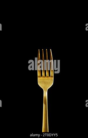 Clean shiny golden fork isolated on white Stock Photo - Alamy