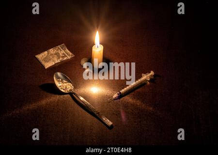 injection, candle and Heroine of a junkie Stock Photo - Alamy