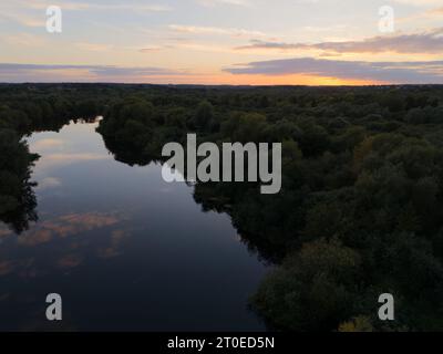 Above the river Yare looking towards Norwich at sunset. With the ...