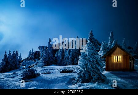 Christmas hut with lighted window in a snowy winter landscape Stock ...