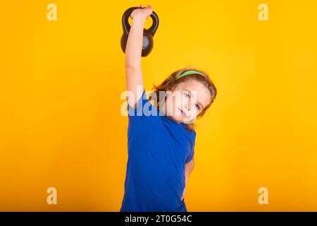 Kid boy working out with dumbbells. Sport and kids training Stock Photo ...