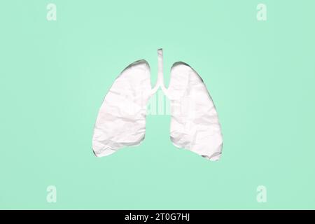 Cut out lungs on turquoise background. Lung cancer concept Stock Photo ...