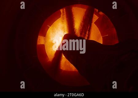 Work area of rotating lime burning kiln with burning flame Stock Photo ...