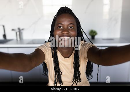 Photo of sweet adorable dark skin woman dressed red sweater showing two ...