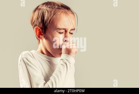 Treatment of colds and flu. Boy coughing sick colds sneezing cough ...