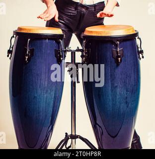 Performers playing bongo drums. Close up of musician hand playing ...