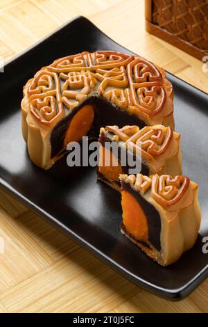 Fresh baked traditional Chinese mooncake with a filling of red bean ...