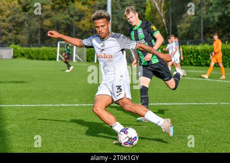 Swansea, Wales. 7 October 2023. Zane Myers of Swansea City holds off ...