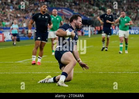 Scotland's Ewan Ashman scores their side's first try during the Quilter ...