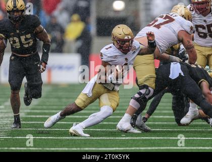 Boston College quarterback Thomas Castellanos (1) hands the ball of to ...